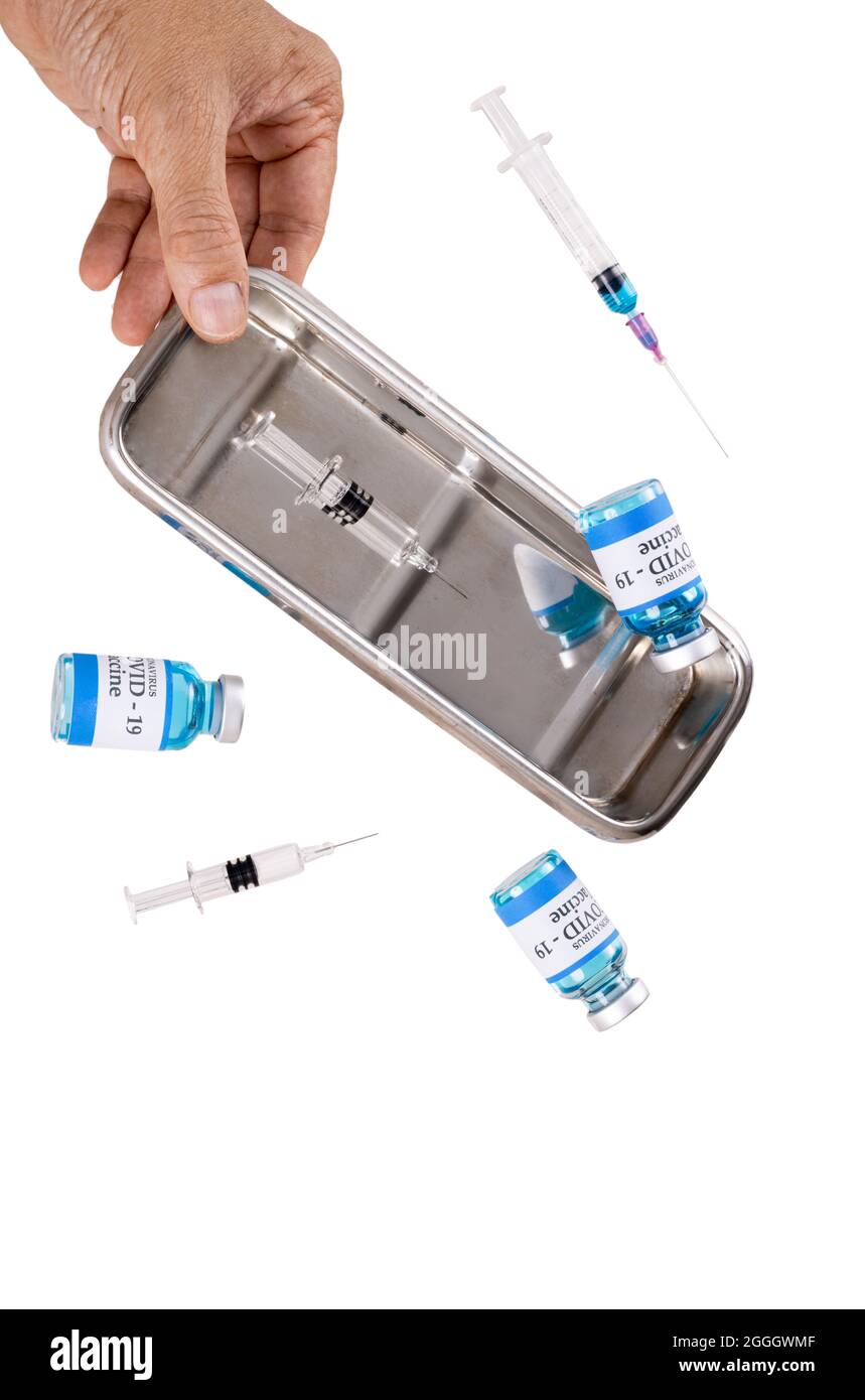 A hand holding a metal tray with falling glass vials labelled covid-19 ...