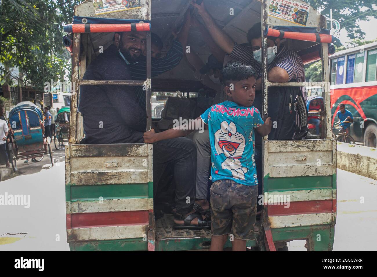 Dhaka, Bangladesh. 31st Aug, 2021. A young boy seen on a human hauler ...