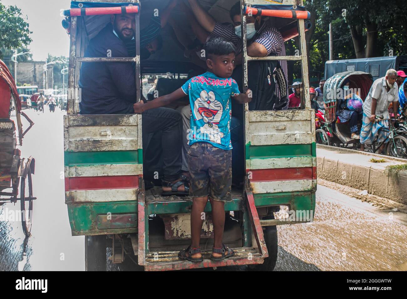 Dhaka, Bangladesh. 31st Aug, 2021. A young boy seen on a human hauler ...