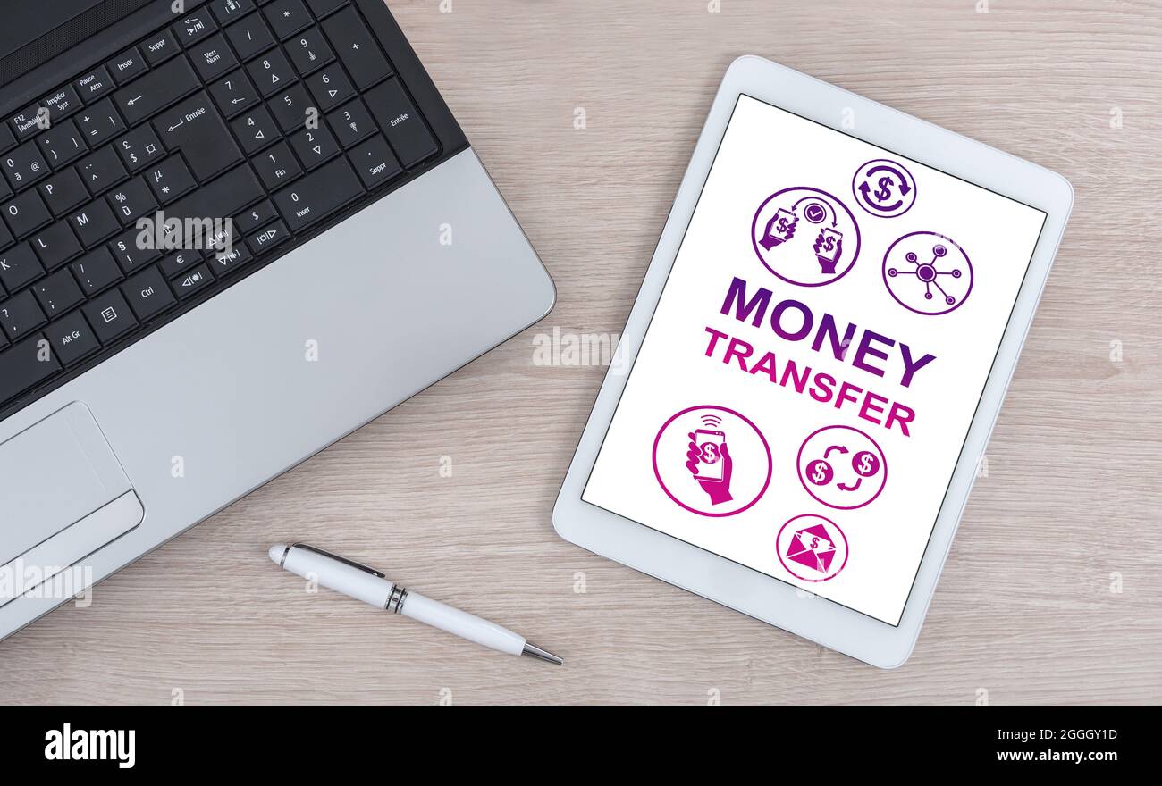 Money transfer concept shown on a digital tablet Stock Photo - Alamy