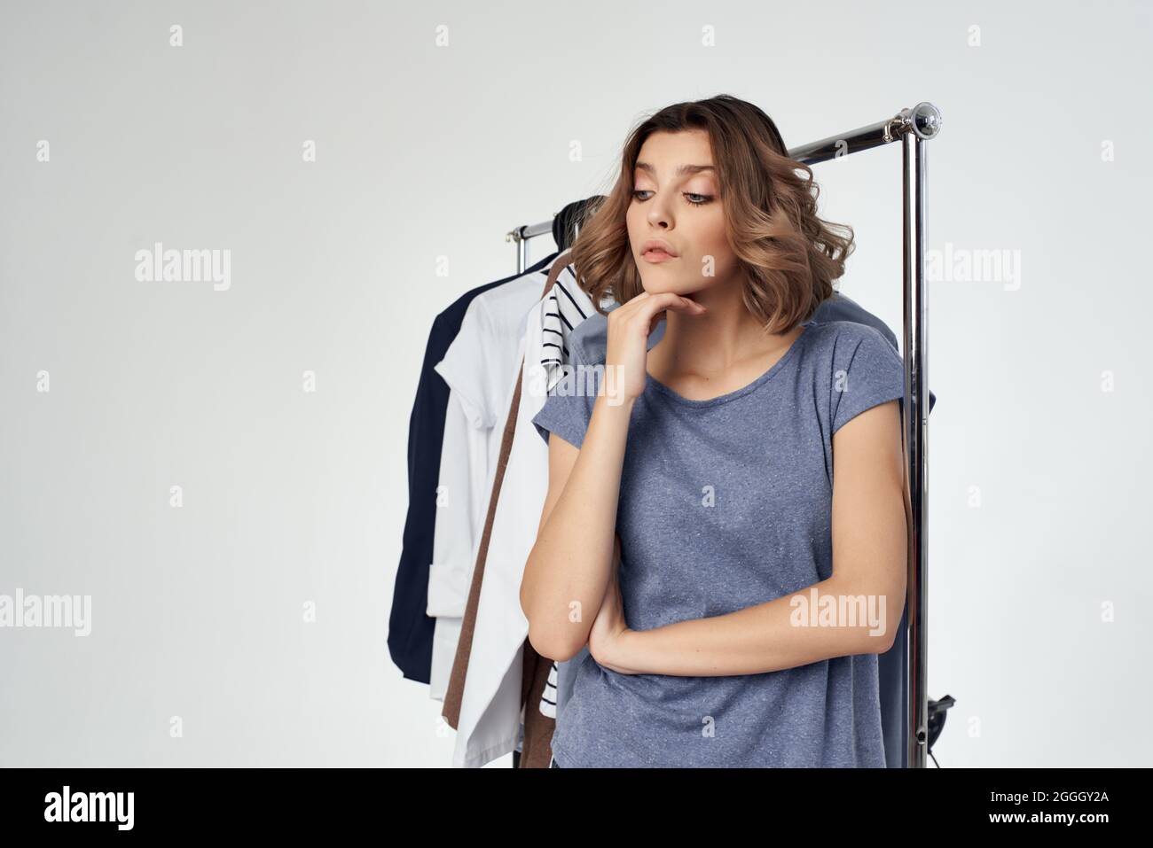 pretty woman Clothes fitting modern style studio Stock Photo - Alamy