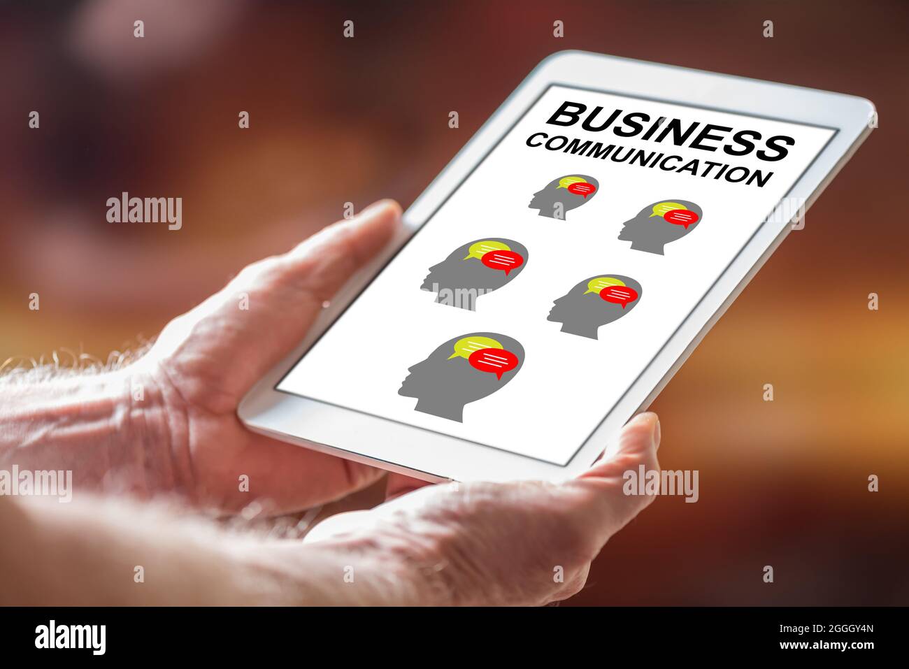 Man holding a tablet showing business communication concept Stock Photo ...