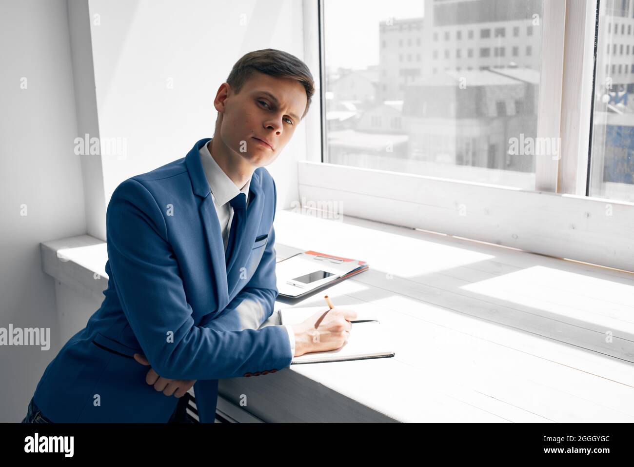 business man manager in office near window documents work Stock Photo ...