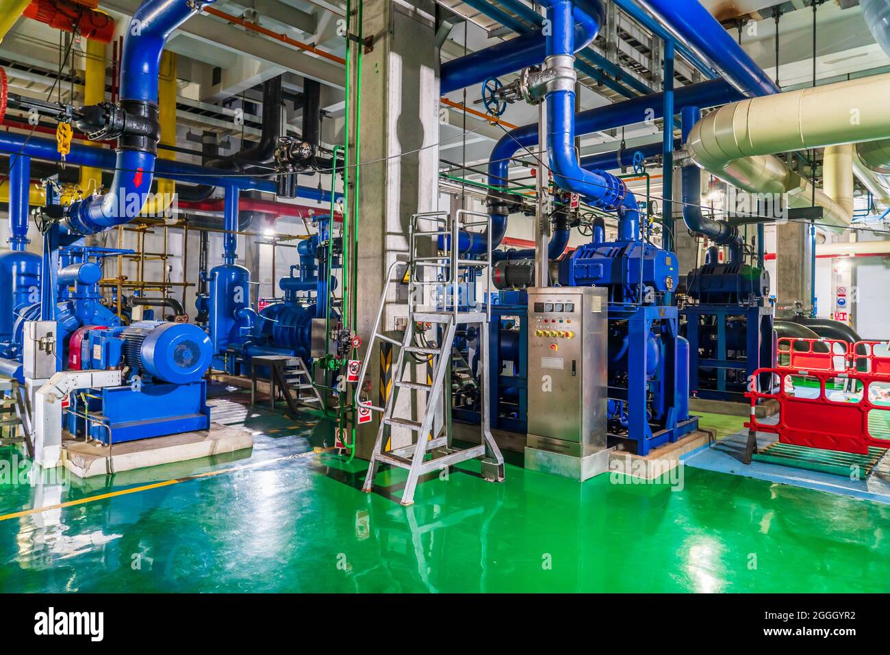 Giant pipes, tubes and equipment inside modern industrial power plant ...