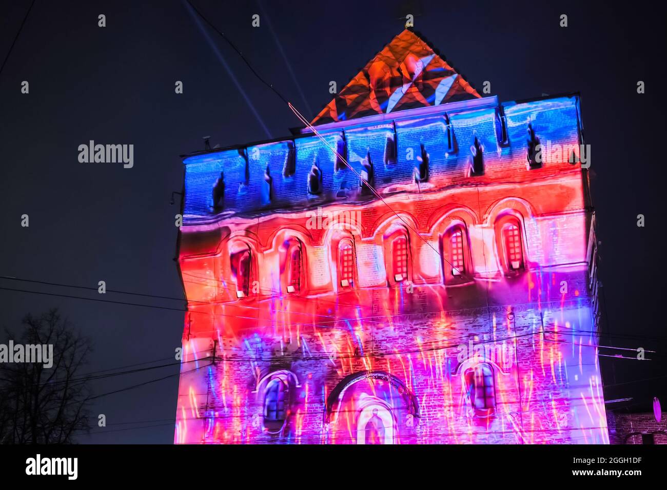 Colorful video mapping show projected on wall of historical building on ...