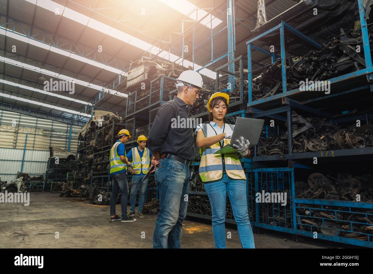 Engineer controller check and talk with engineer working on notebook in ...