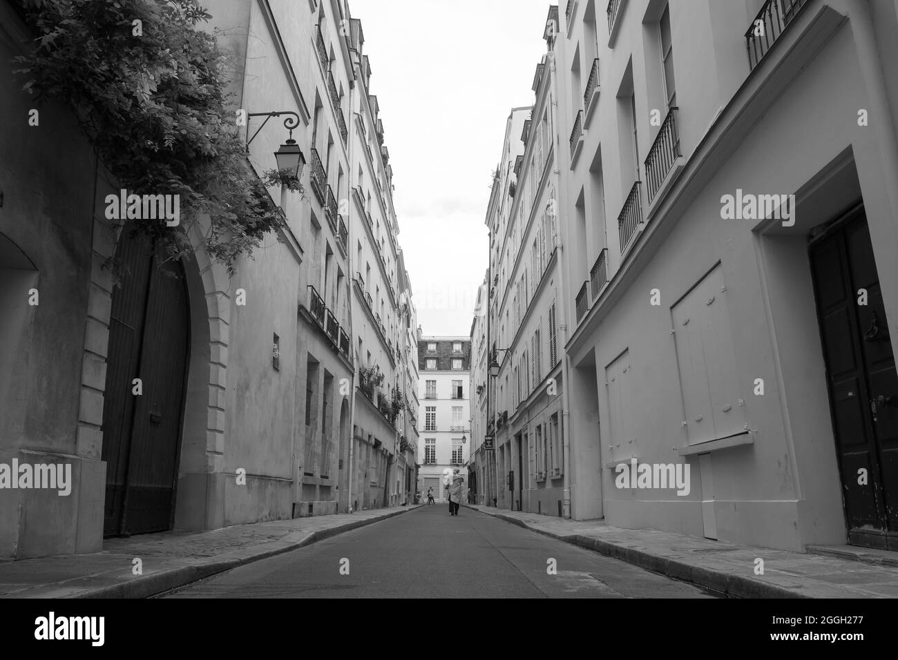 PARIS, FRANCE - Aug 06, 2021: Street on "Ile Saint Louis". A grayscale ...
