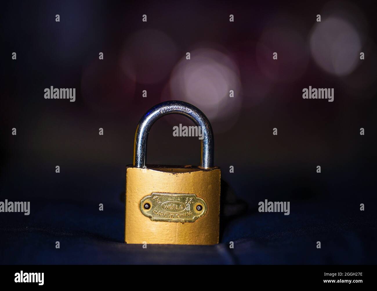 HYDERABAD, INDIA - Aug 01, 2021: A closeup of a golden lock in the dark ...