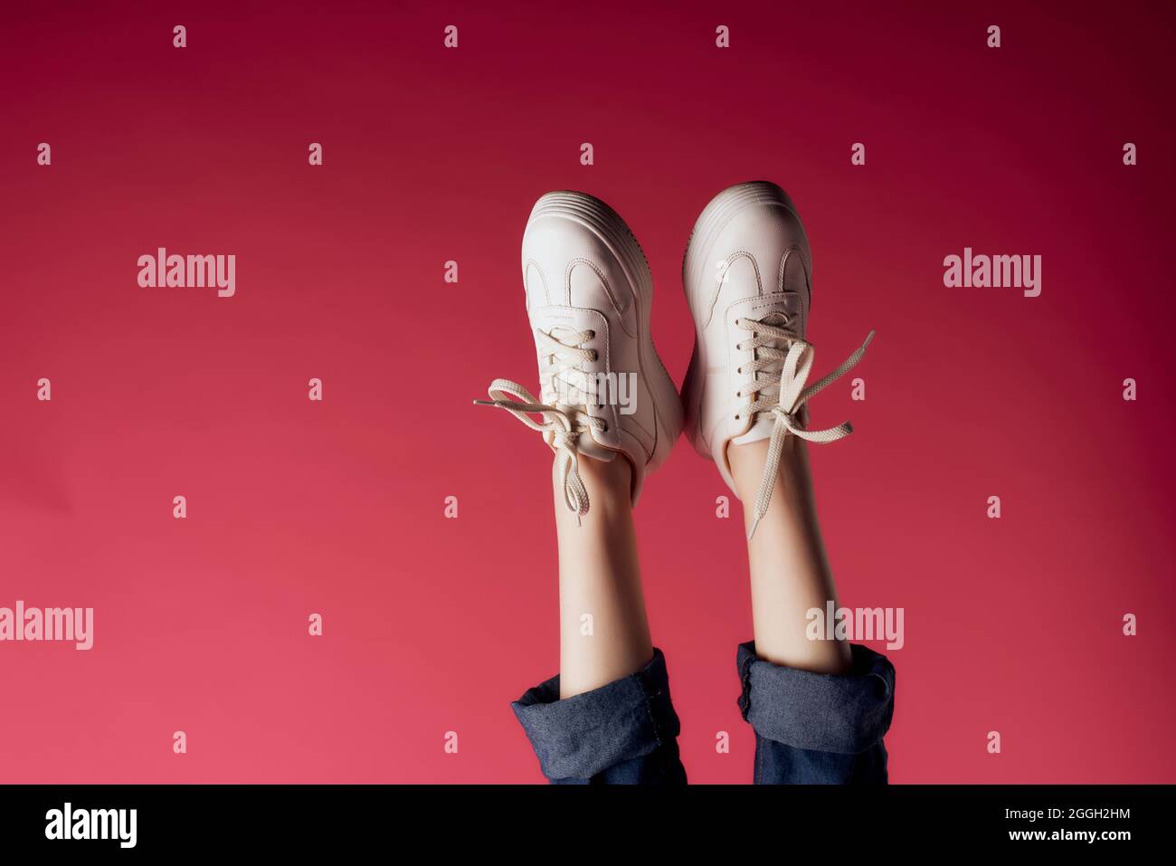 inverted female legs sneakers fashion cropped view Stock Photo - Alamy