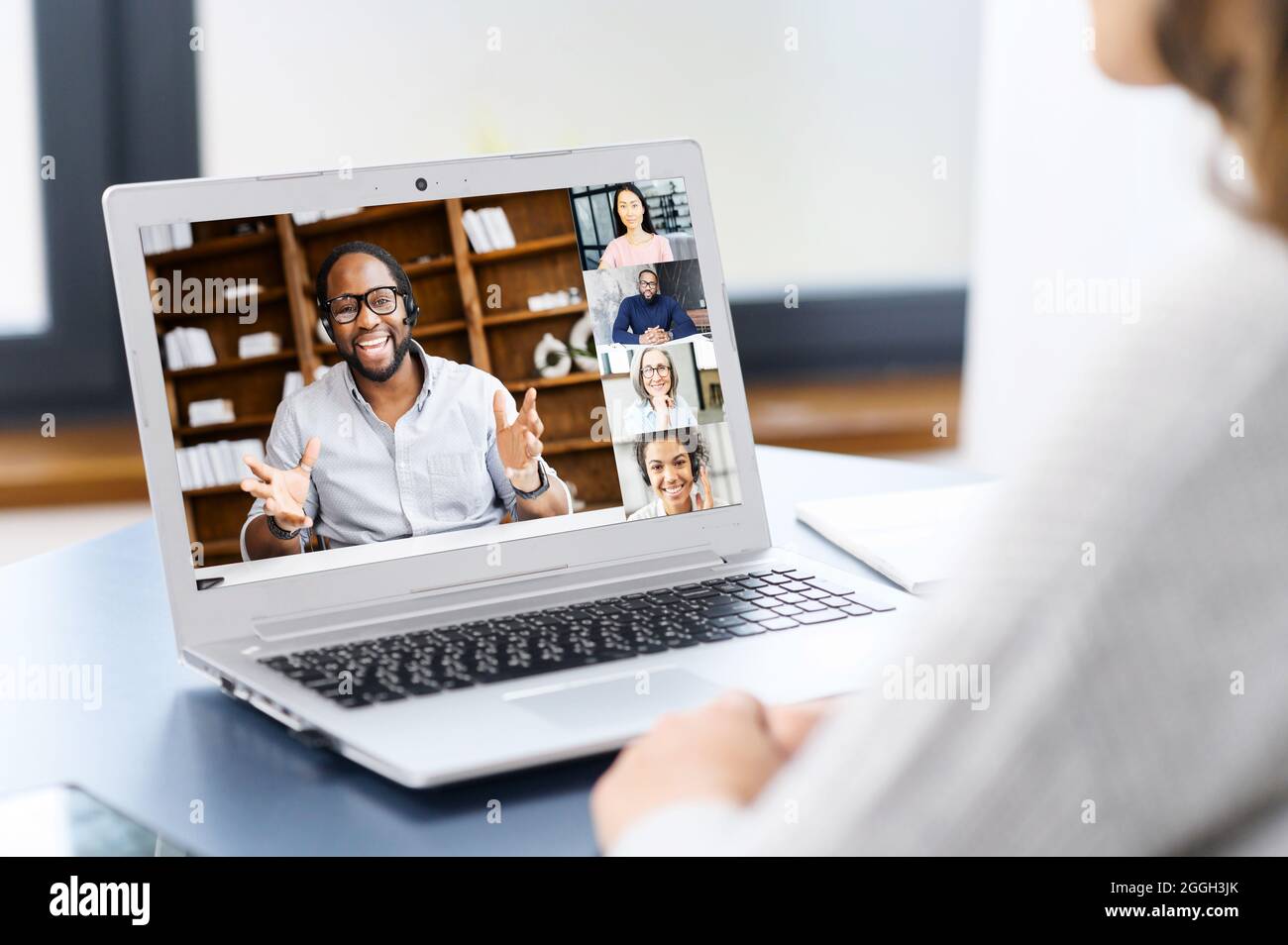 Female freelancer talking online with group of diverse colleagues or ...