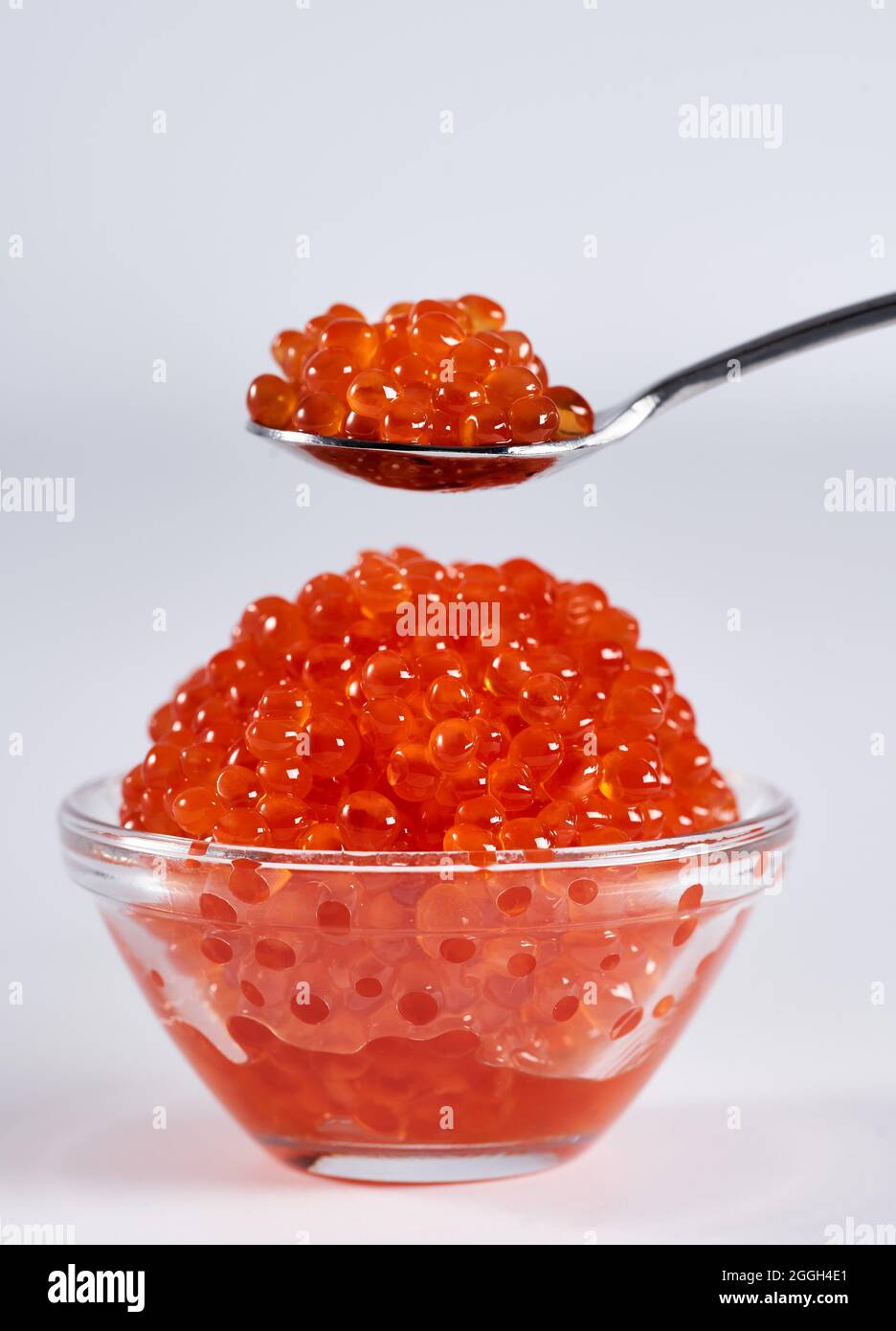 Red salmon roe in a little bowl over white background, isolated Stock ...