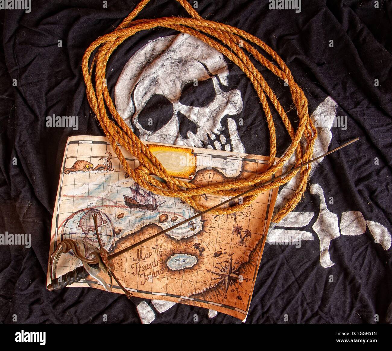 black pirate flag treasure map jolly roger rope and sword Stock Photo ...