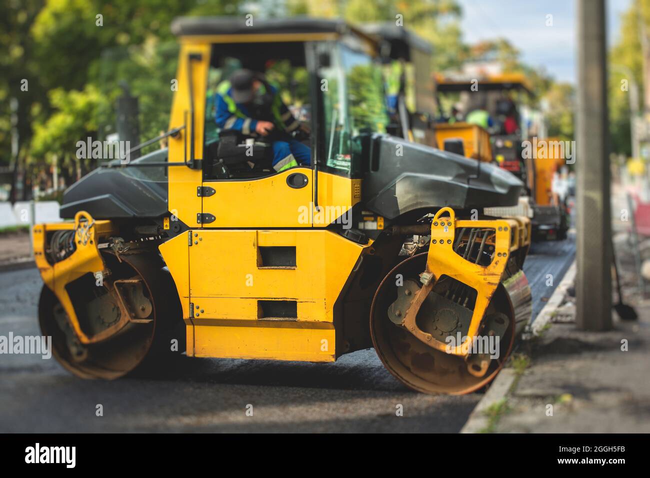 Process of asphalting, blacktopping and paving, asphalt paver machine ...