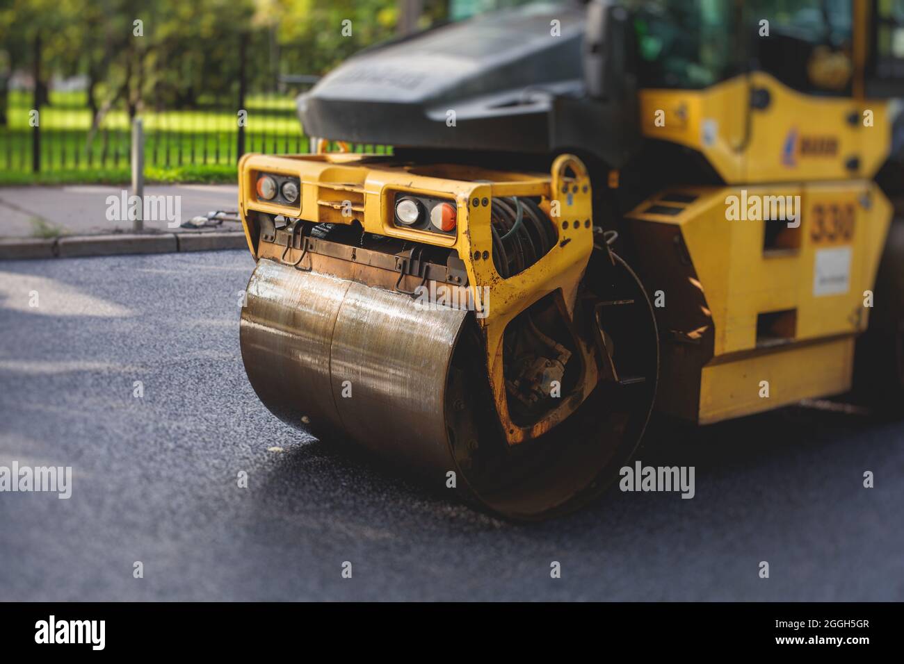 Process of asphalting, blacktopping and paving, asphalt paver machine ...