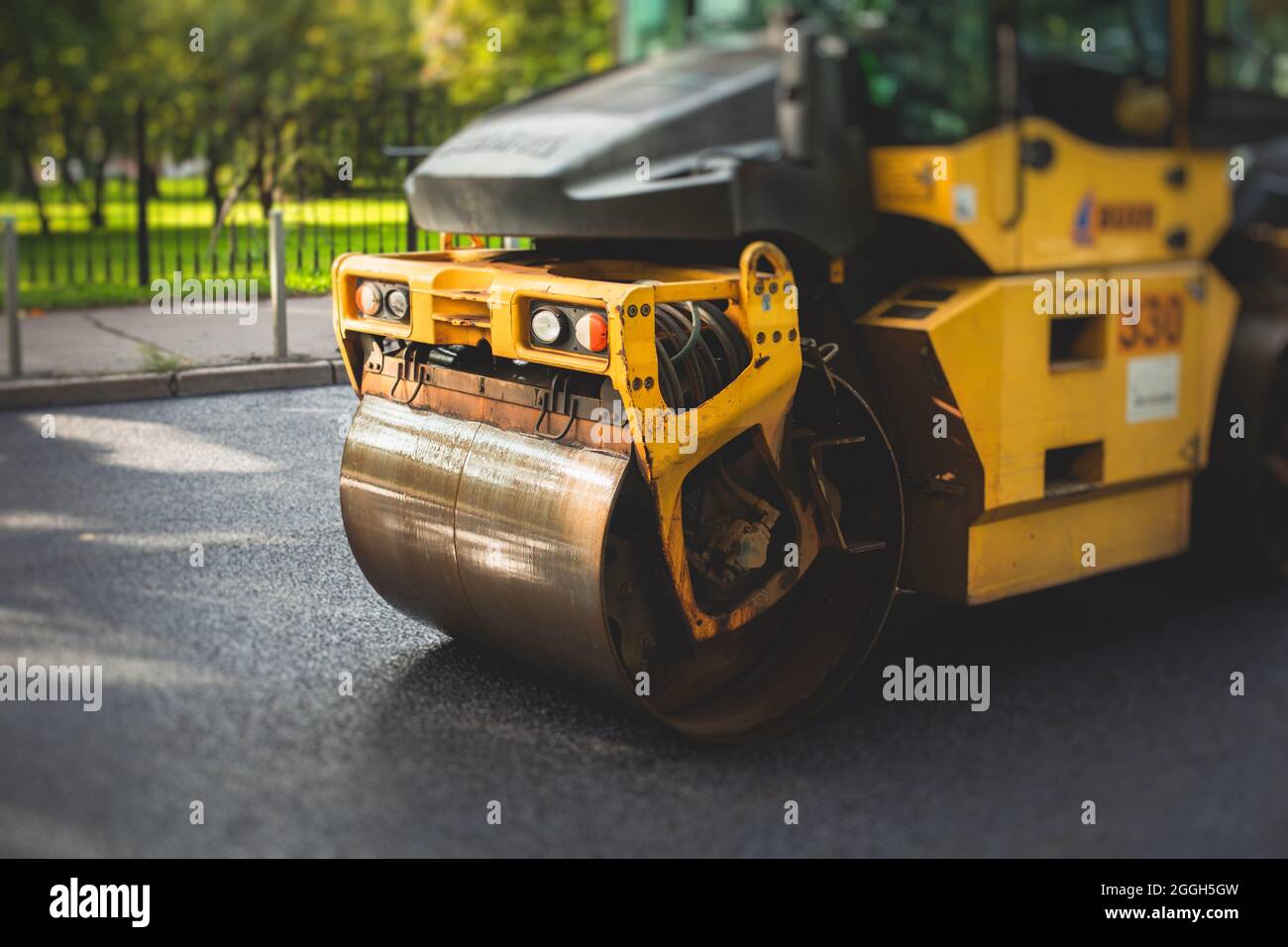 Process of asphalting, blacktopping and paving, asphalt paver machine ...