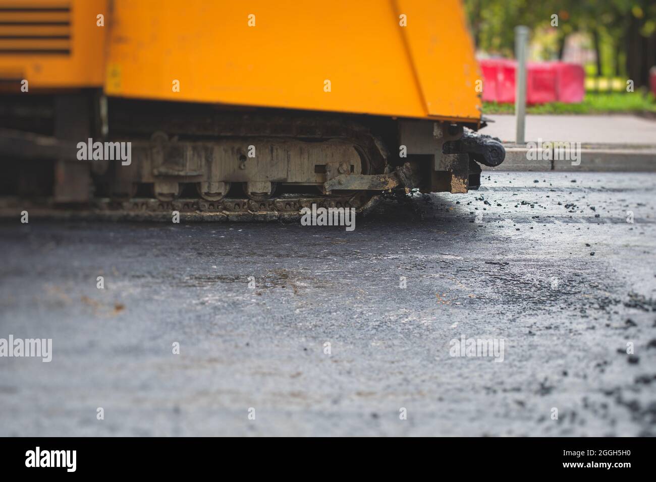 Process of asphalting, blacktopping and paving, asphalt paver machine ...