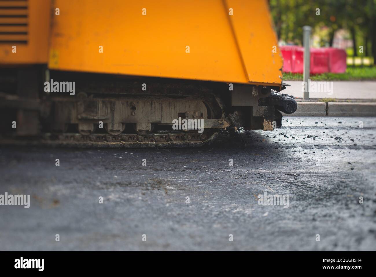 Process of asphalting, blacktopping and paving, asphalt paver machine ...