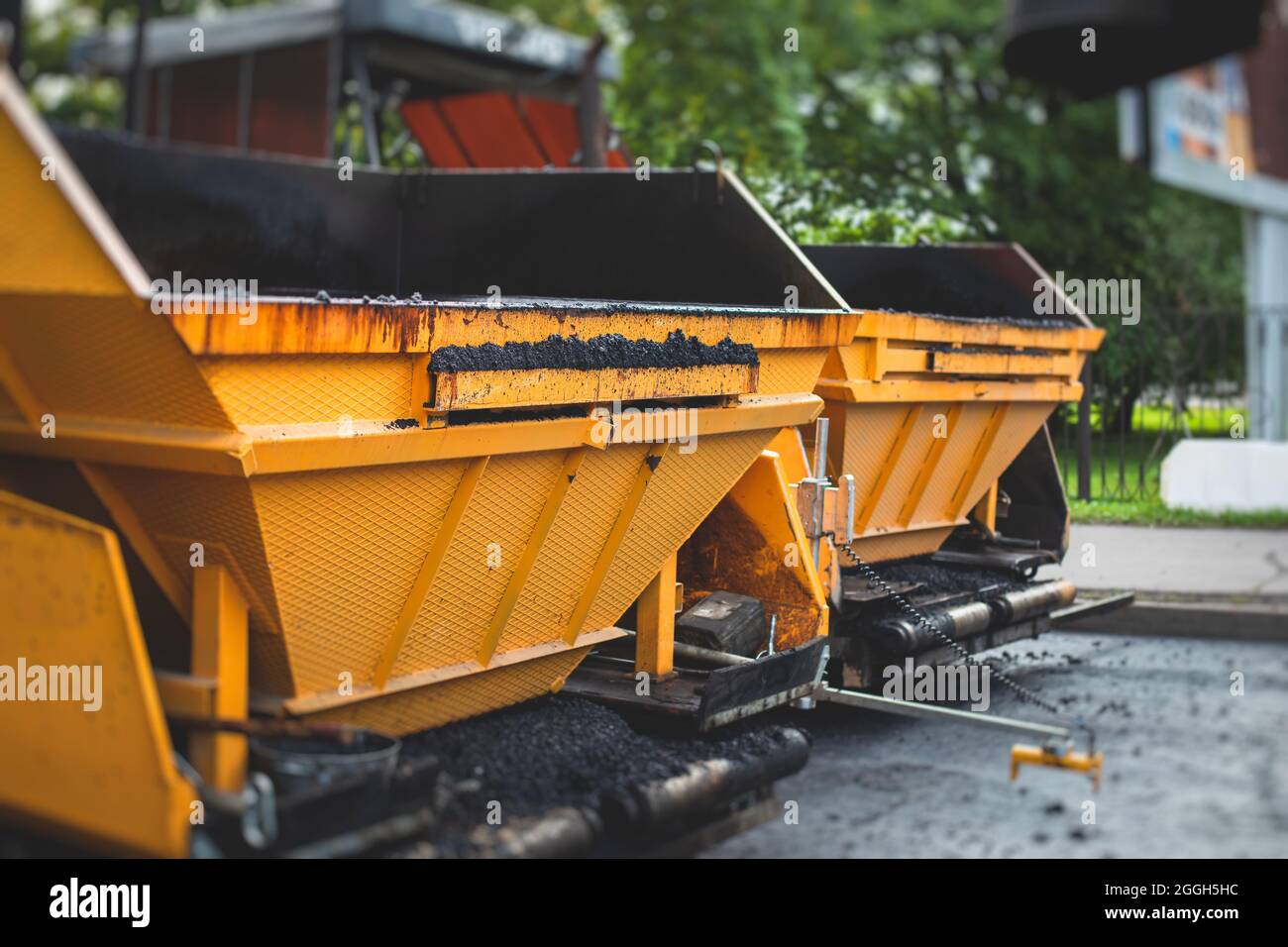 Process of asphalting, blacktopping and paving, asphalt paver machine ...