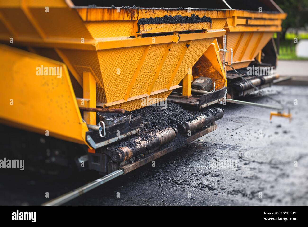 Process of asphalting, blacktopping and paving, asphalt paver machine ...