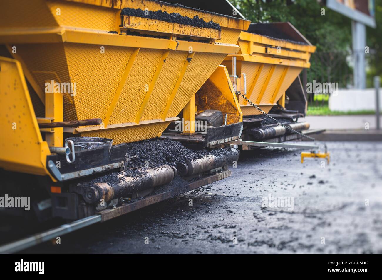 Process of asphalting, blacktopping and paving, asphalt paver machine ...