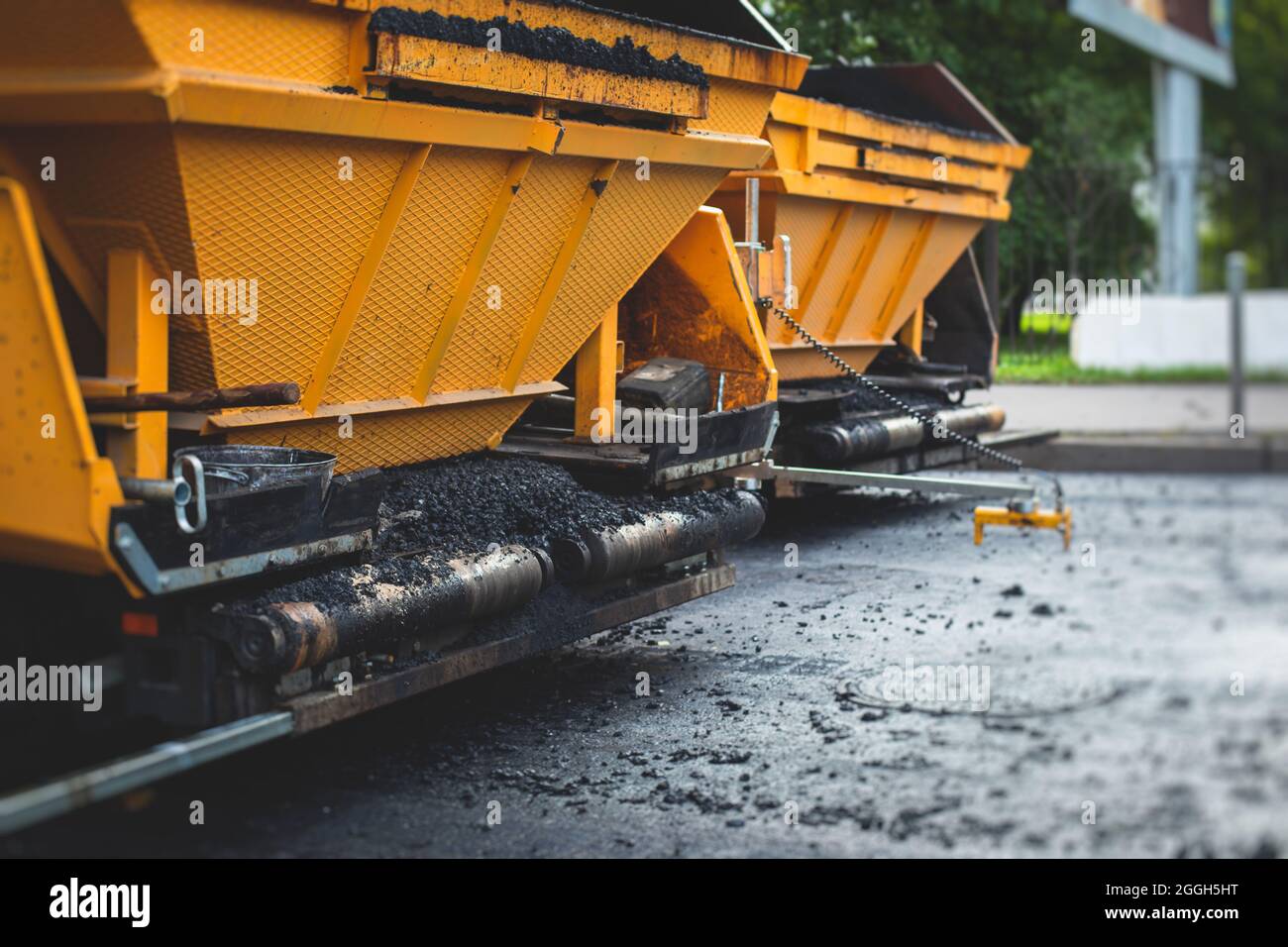 Process of asphalting, blacktopping and paving, asphalt paver machine ...