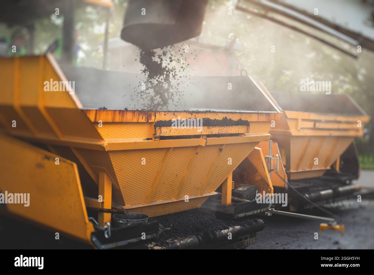 Process of asphalting, blacktopping and paving, asphalt paver machine ...