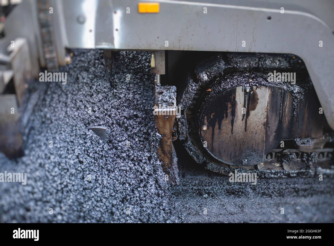 Process of asphalting, blacktopping and paving, asphalt paver machine ...