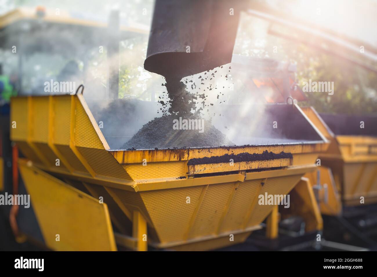 Process of asphalting, blacktopping and paving, asphalt paver machine ...