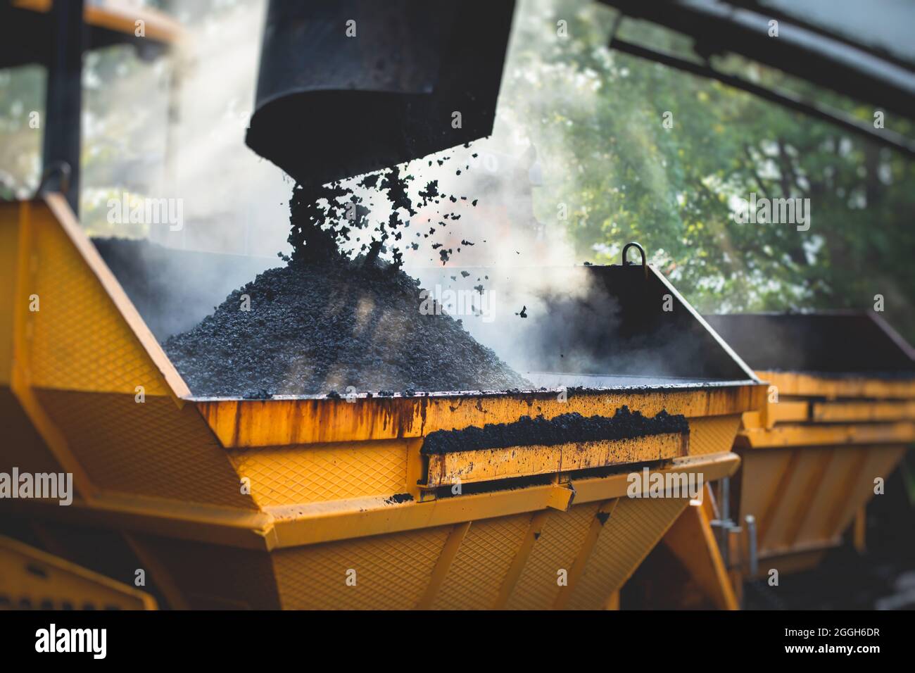 Process of asphalting, blacktopping and paving, asphalt paver machine ...