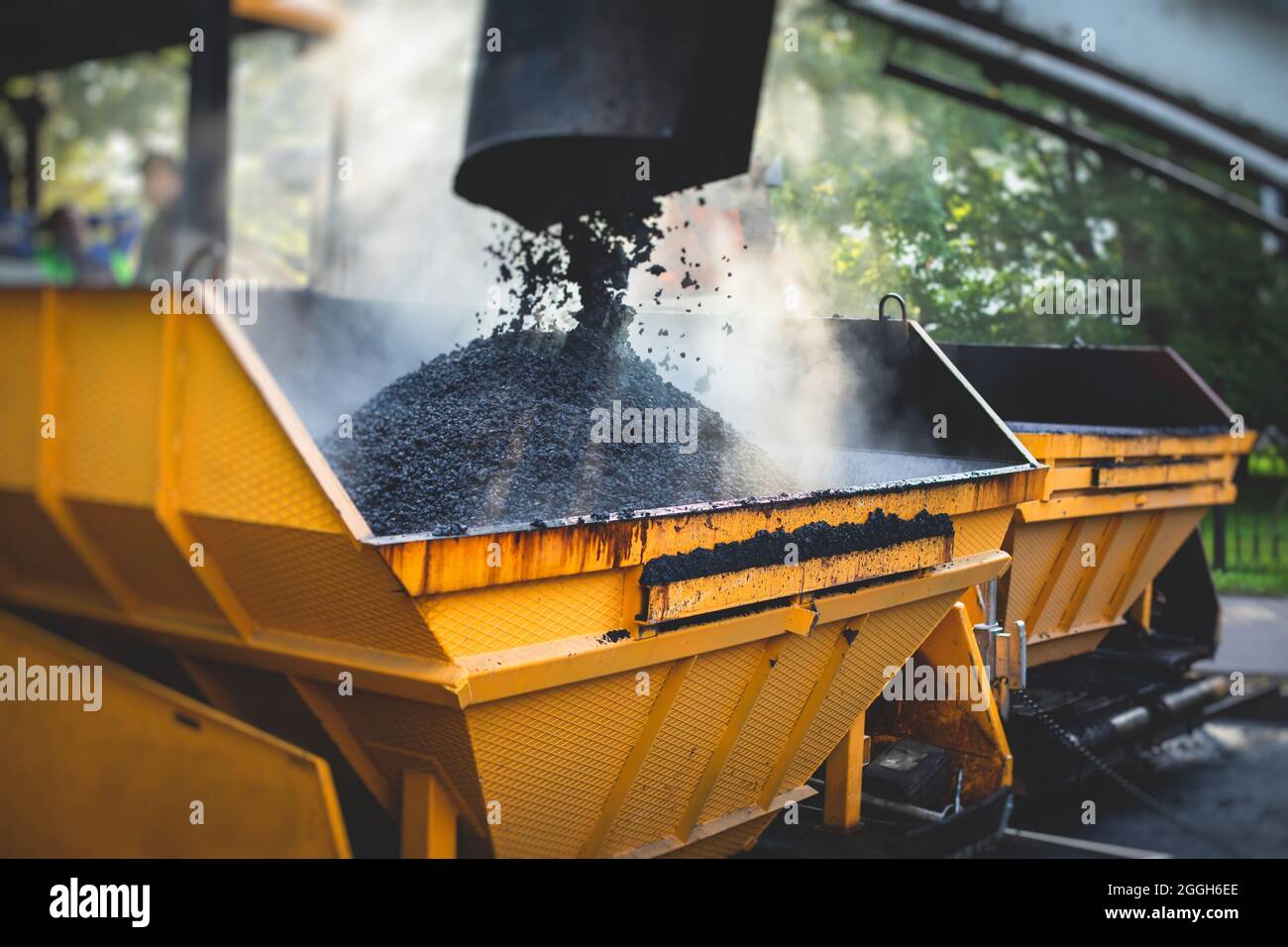 Process of asphalting, blacktopping and paving, asphalt paver machine ...