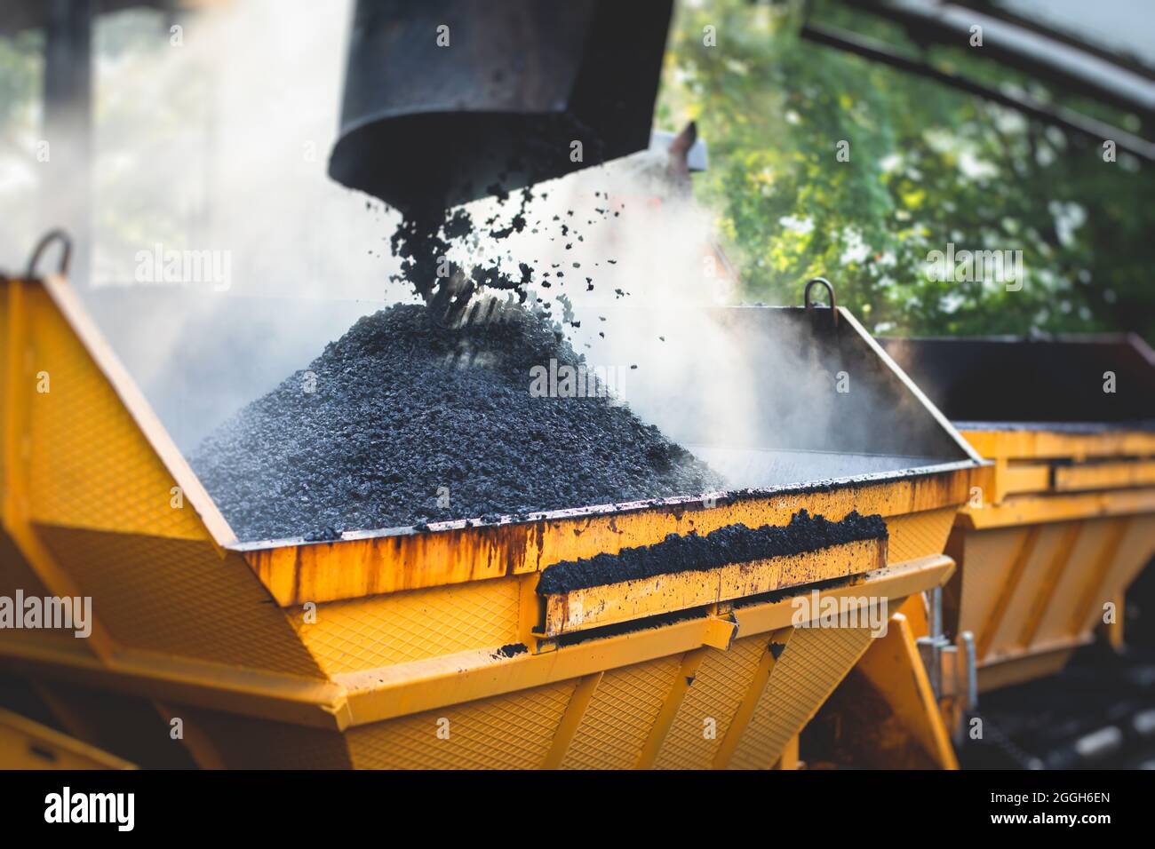 Process of asphalting, blacktopping and paving, asphalt paver machine ...