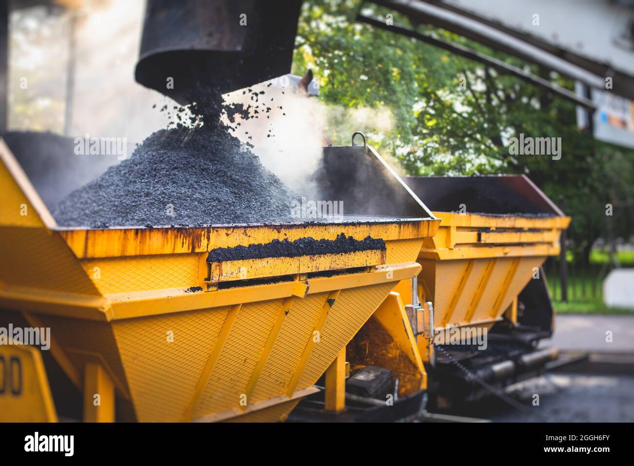 Process of asphalting, blacktopping and paving, asphalt paver machine ...