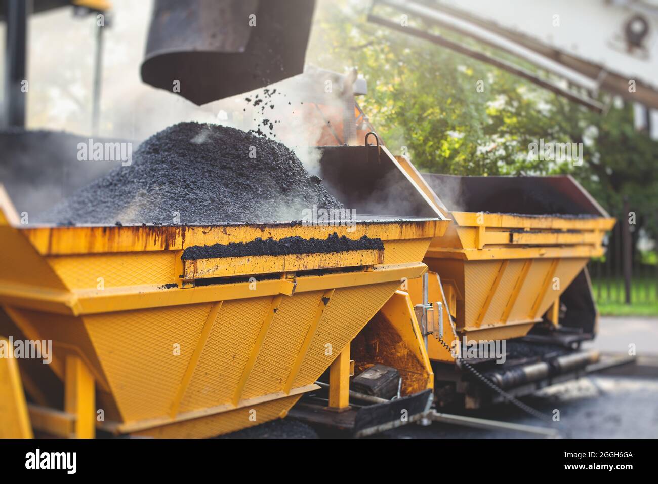 Process of asphalting, blacktopping and paving, asphalt paver machine ...