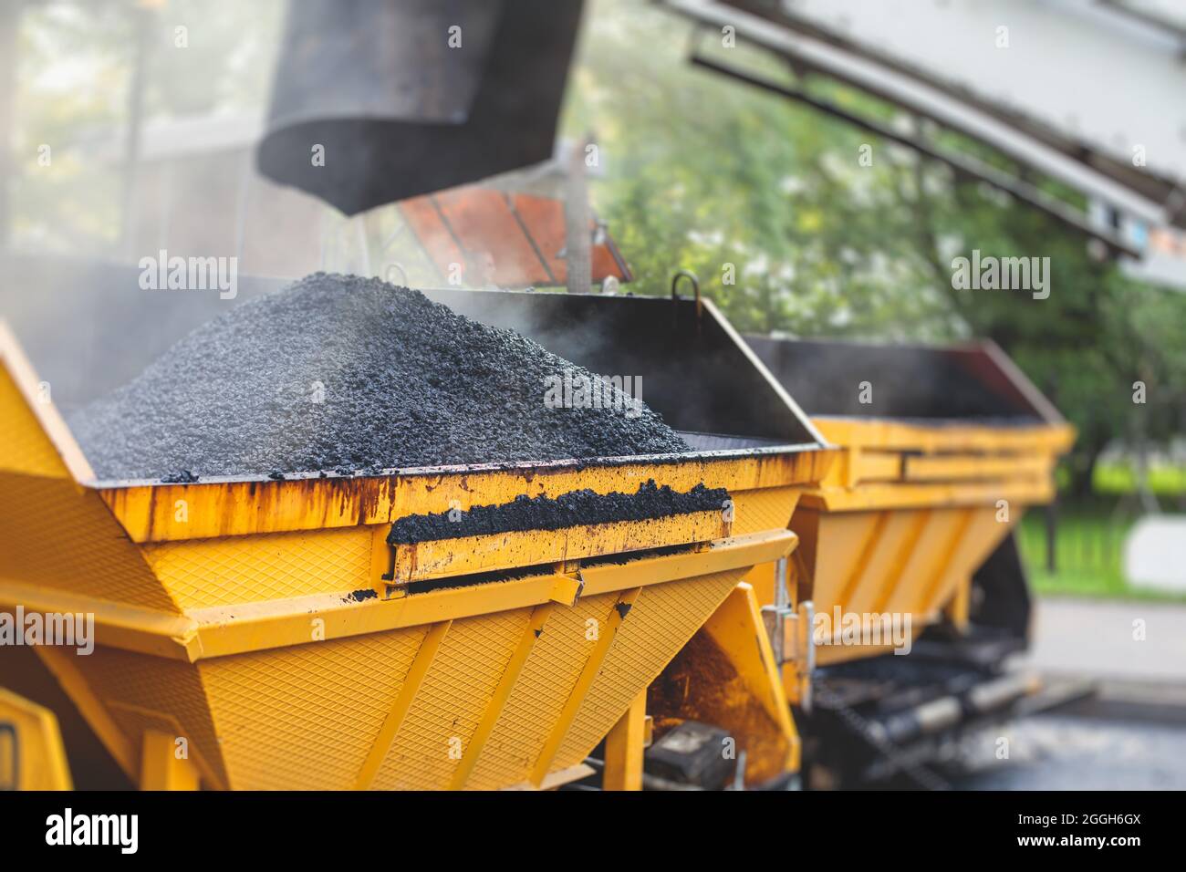Process of asphalting, blacktopping and paving, asphalt paver machine ...