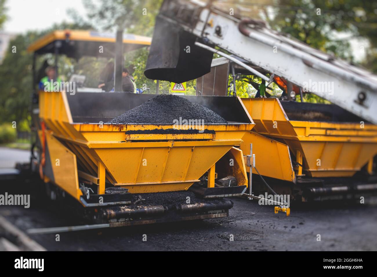 Process of asphalting, blacktopping and paving, asphalt paver machine ...