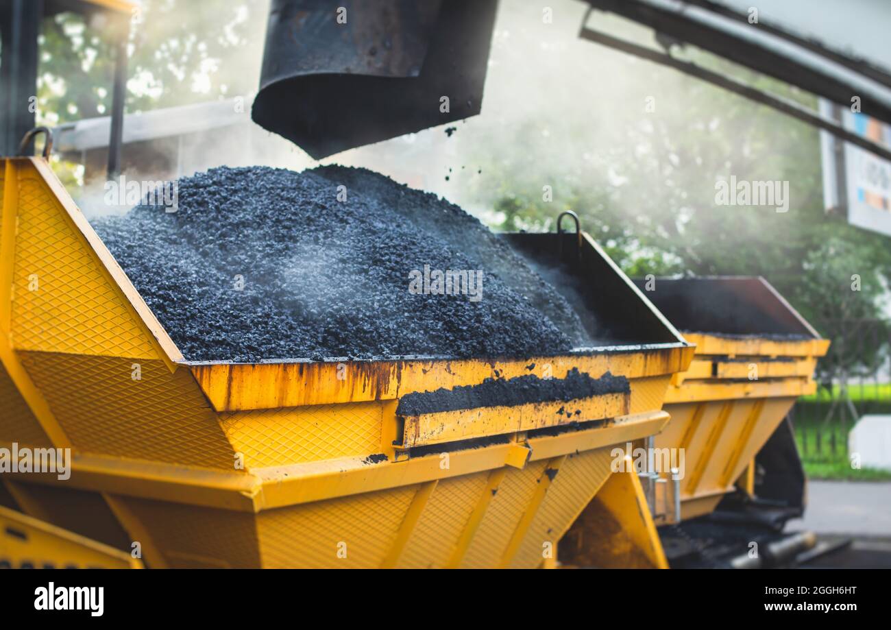 Process of asphalting, blacktopping and paving, asphalt paver machine ...