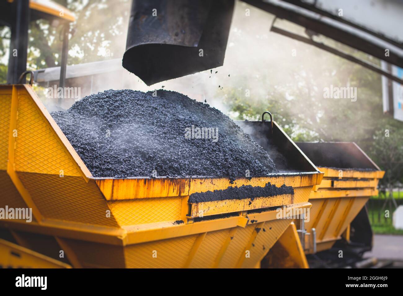 Process of asphalting, blacktopping and paving, asphalt paver machine ...