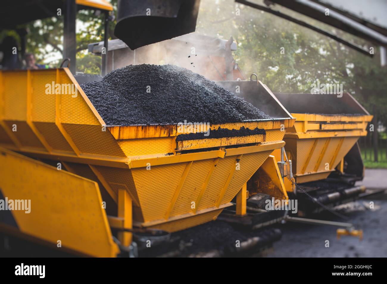 Process of asphalting, blacktopping and paving, asphalt paver machine ...