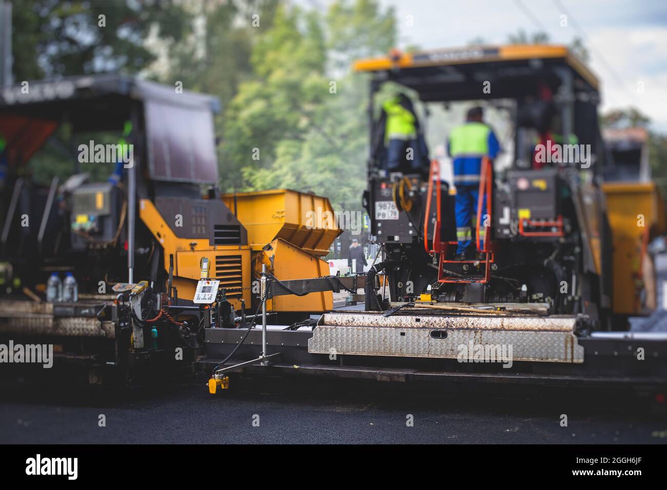 Process of asphalting, blacktopping and paving, asphalt paver machine ...