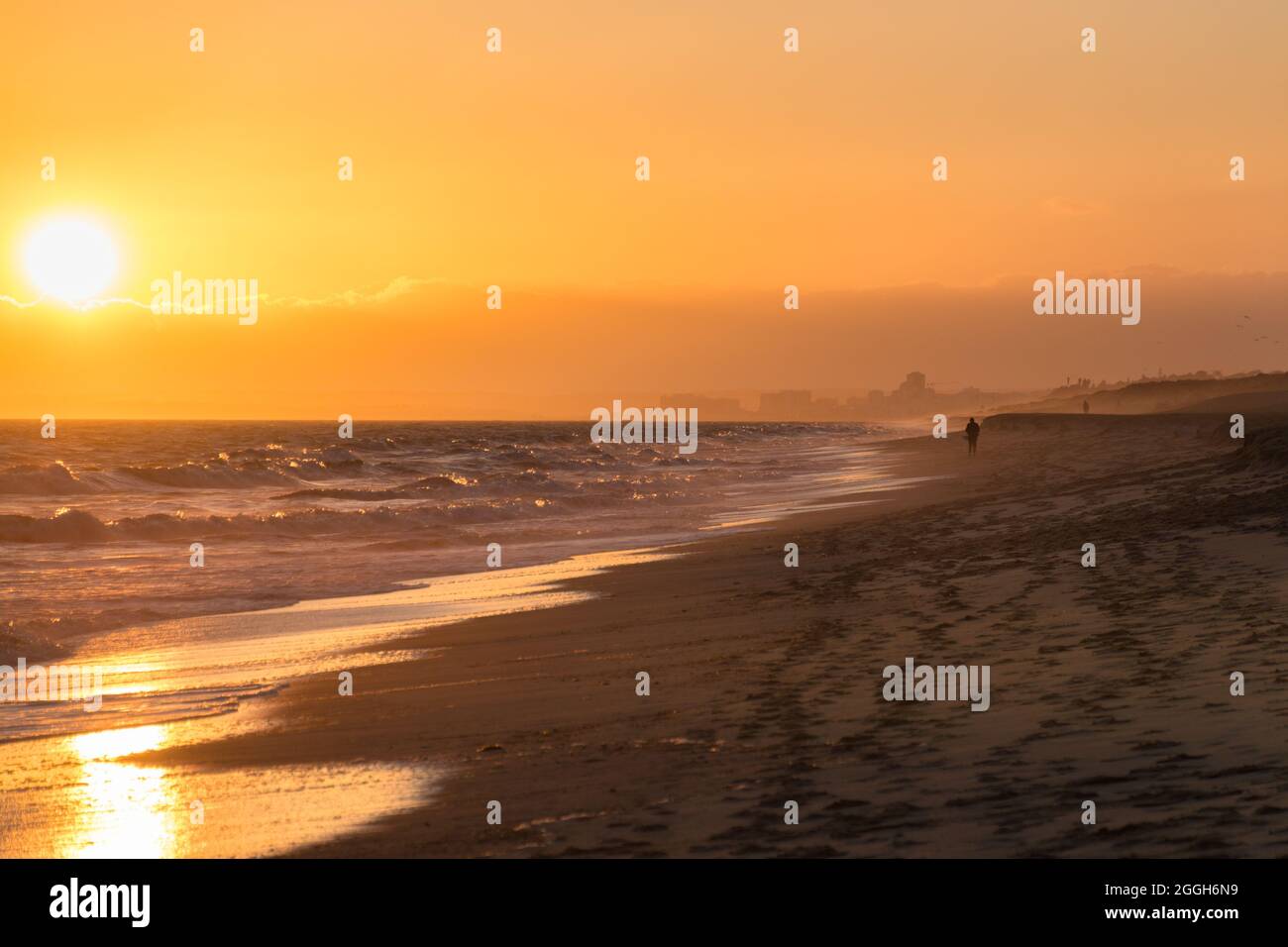 Praia de Faro sunset Stock Photo - Alamy