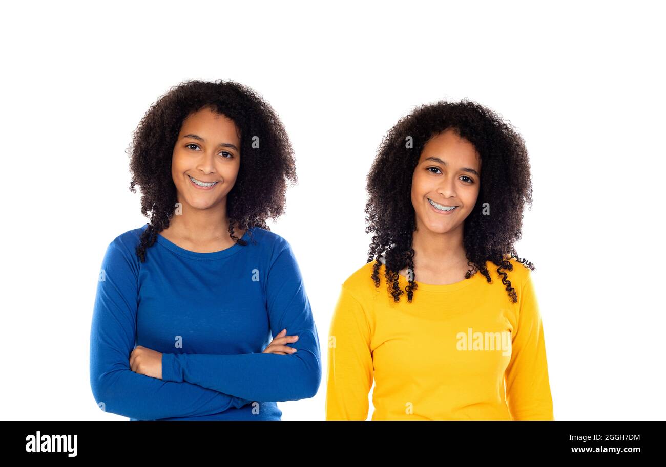 African twin sisters with afro hair isolated on a white background ...