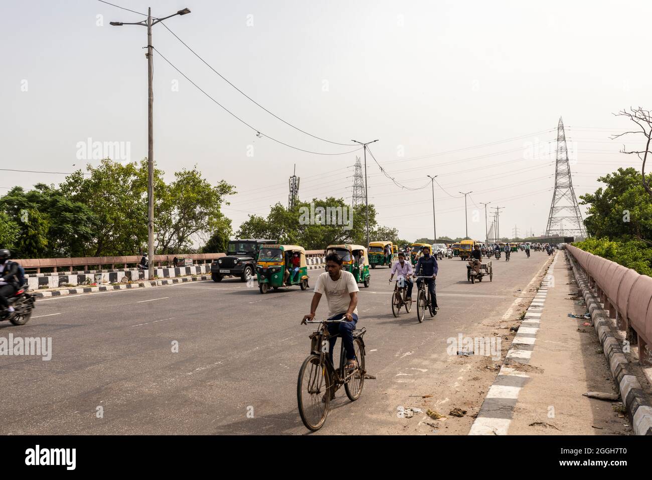 View of various types of traffic on the roads of Delhi Stock Photo - Alamy
