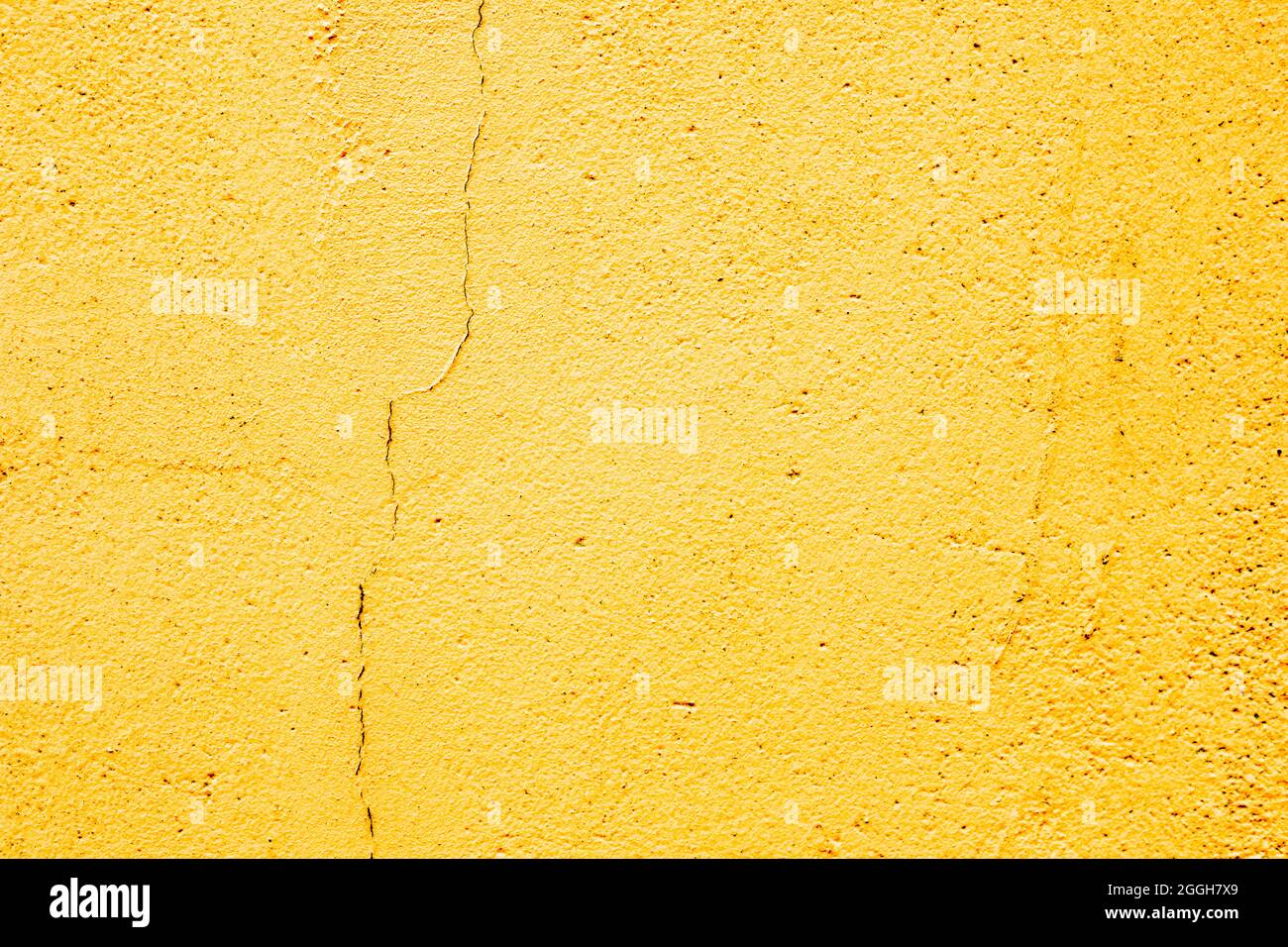 Yellow stone wall texture may used as background Stock Photo - Alamy