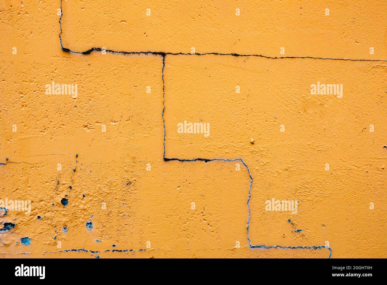 Yellow stone wall texture may used as background Stock Photo - Alamy