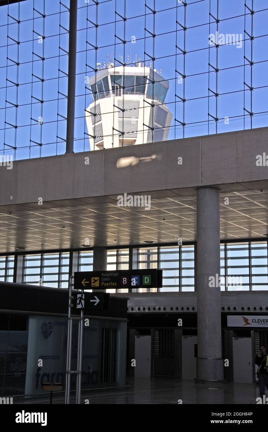Check in hall in terminal three departure lounge with the control tower ...
