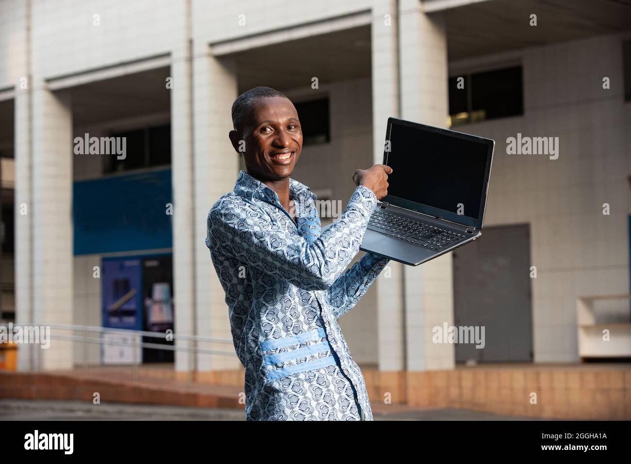 handsome young african american man working using a computer very happy ...