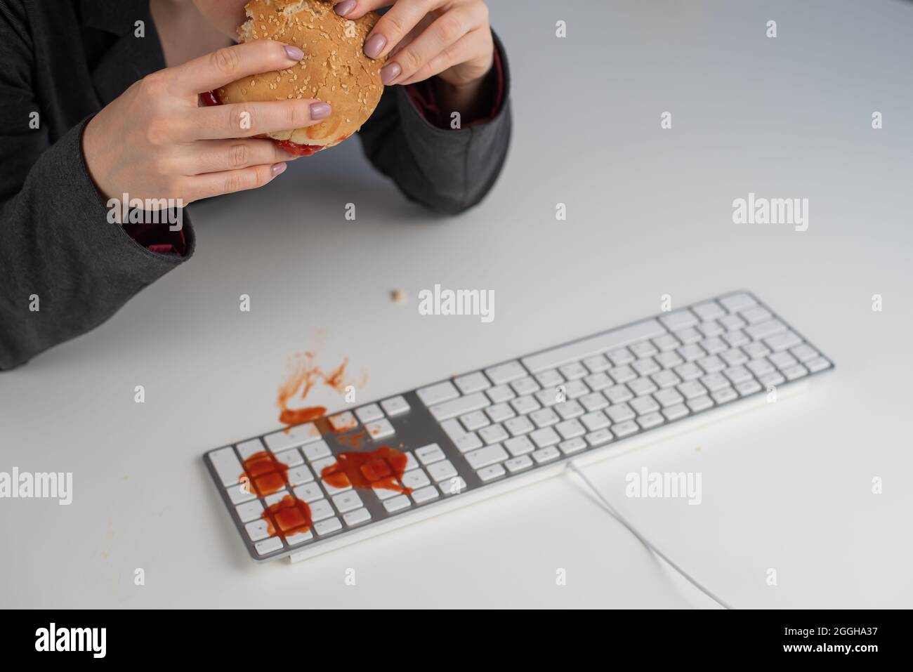 Woman desk snack unhealthy hi-res stock photography and images - Alamy