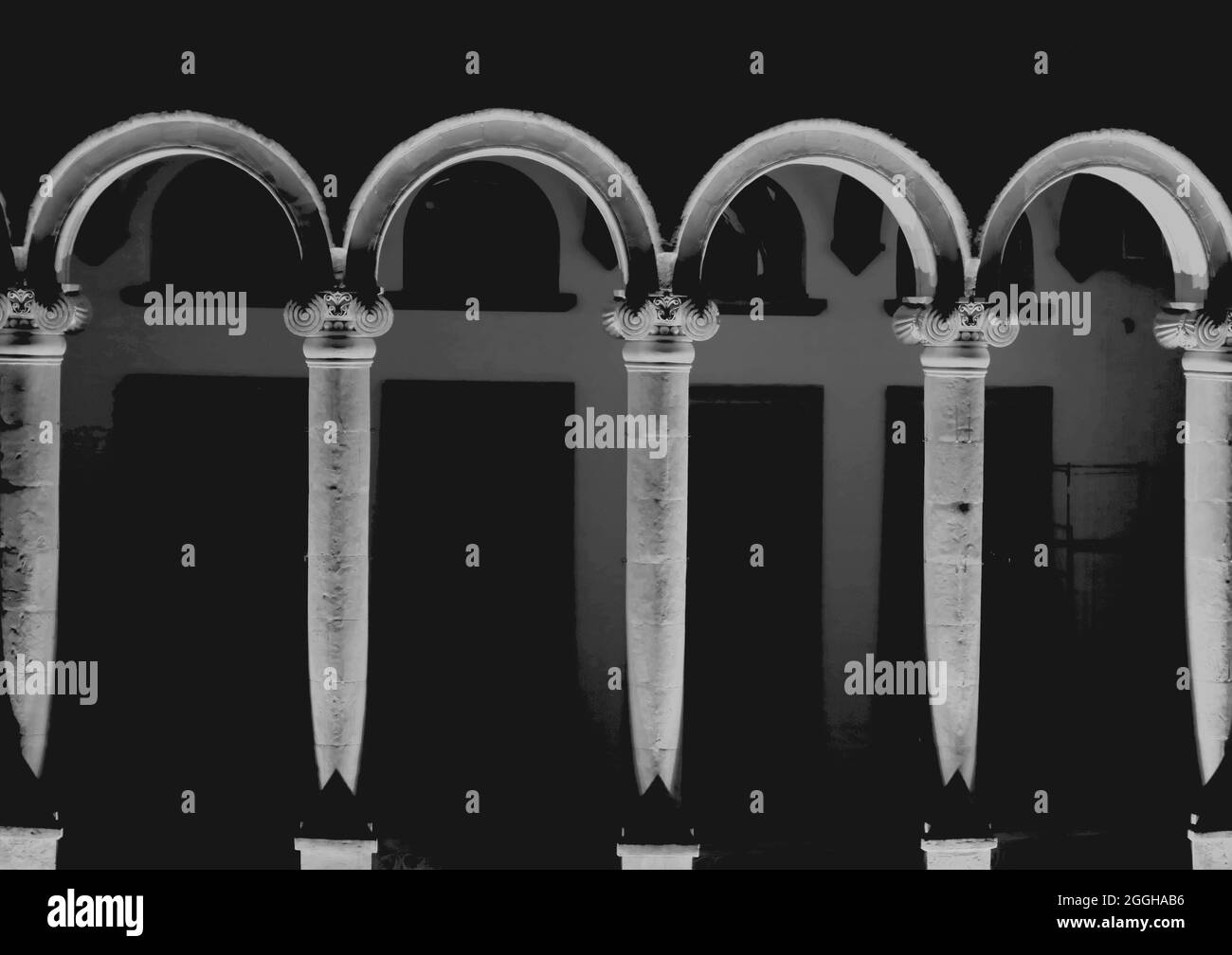 Light-up columns and arches of a Romanesque style architecture at night ...