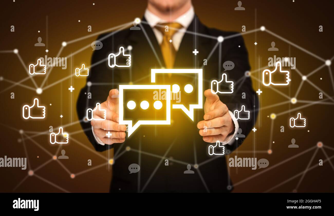 Hand holding social media icons Stock Photo - Alamy
