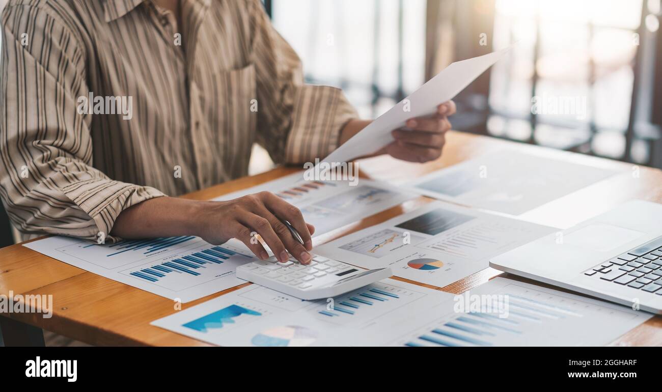 Business accounting concept, Business man using calculator with ...